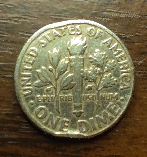 2000 dime with similar marking to one of your 1990 dimes. Coincidence ...